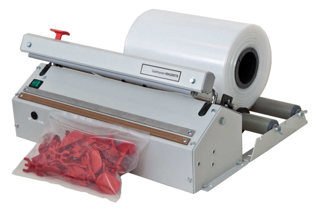 Film sealing unit Sealmaster Magneta - Willi Kopp Packaging Systems