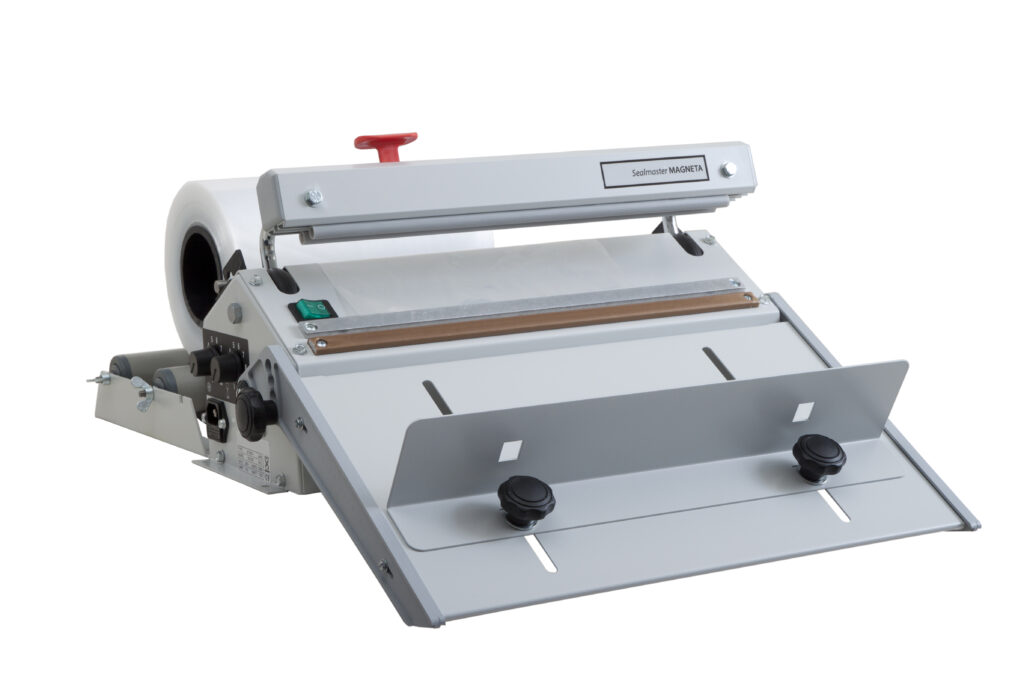 Film sealing unit Sealmaster Magneta - Willi Kopp Packaging Systems